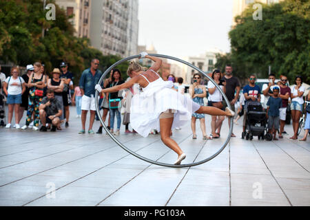 Woman performing with Cyr wheel, Barcelona Stock Photo - Alamy