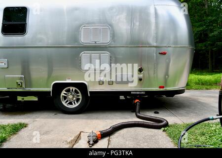 Airstream travel trailer at the dump station emptying its grey water ...