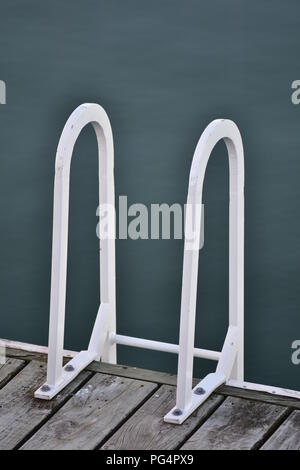 Floating jetty with wooden floor and metal welded cleats and car tyre ...