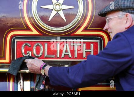 A steam enthusiast polishes the name plate of the Burrell Showman's ...