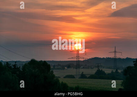 Beautiful scenery of electricity wires over a landscape at sunset Stock ...