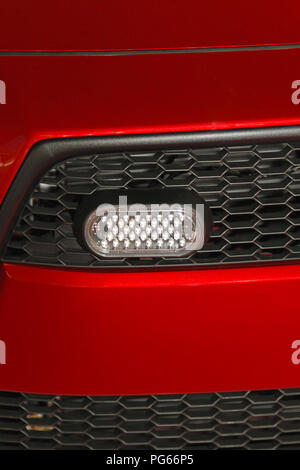 LED lights at red car grille Stock Photo - Alamy