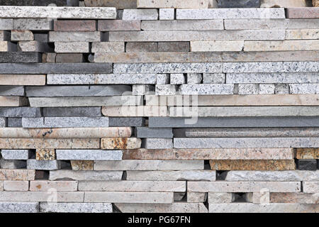 Big pile of various marble stone tiles Stock Photo - Alamy