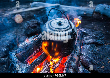 boiling over the fire Stock Photo - Alamy