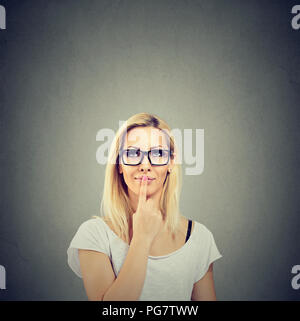 Pretty girl face daydreaming. Pensive young woman thinking in ...