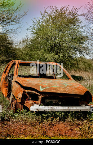 Devastated burned car wrack. Effects of an accident Stock Photo - Alamy