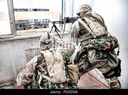 Army machine gunner attacks enemy with aimed fire Stock Photo - Alamy