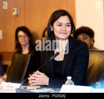 Michelle Giuda, Assistant Secretary of State, listens as First lady ...