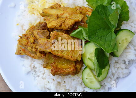 curry pork bone on rice eat with bitter cucumber boiled soup Stock ...