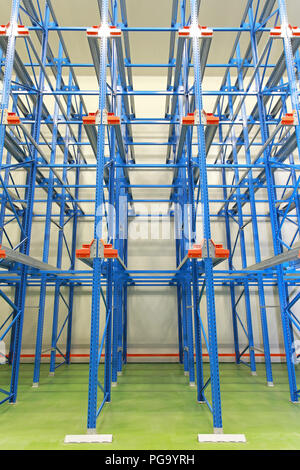 Blue shelving system in distribution warehouse Stock Photo - Alamy
