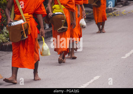 Tak bat ceremony in the morning - Buddhist monks receive rice and food ...