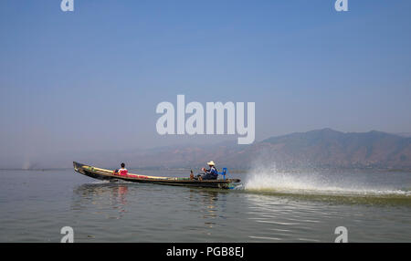 Speed boat running on Inle (Inlay) lake in Myanmar. Taking a boat is a ...