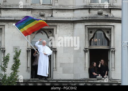 A rainbow flag is flown next to a likeness of Pope Francis as crowds ...