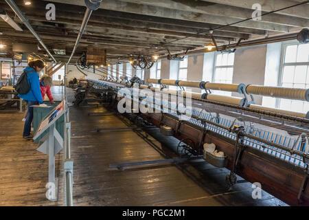 Two old women making yarn with spinning-wheel and spindle, carpet ...
