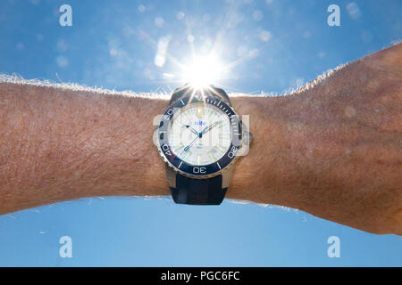 Watch made by British manufacturer Nite watches being worn on a beach ...