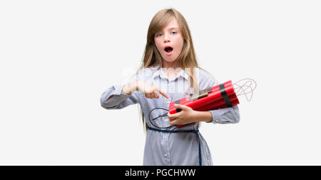 Young blonde child holding dynamite bomb with happy face smiling doing ...