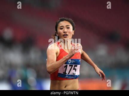 Jakarta. 26th Aug, 2018. Wang Dou (L) of China competes during the ...