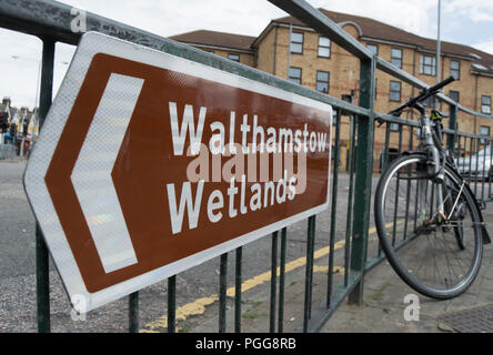 left pointing sign for walthamstow wetlands, in walthammstow, london ...