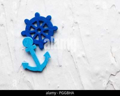 Background with decorative anchors and wheels on a white painted ...