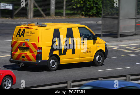 AA automobile association van driving along a snow covered road in ...