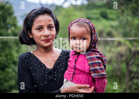 A Nepalese mother and child in traditional clothing in the Himalayan ...