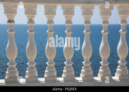 Baluster beach. White columns overlooking the sea. View of white ...