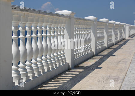 Baluster beach. White columns overlooking the sea. View of white ...