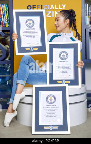 Chinese contortionist Liu Teng performs during an attempt to set a new ...