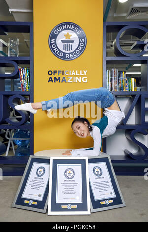 Chinese contortionist Liu Teng performs during an attempt to set a new ...