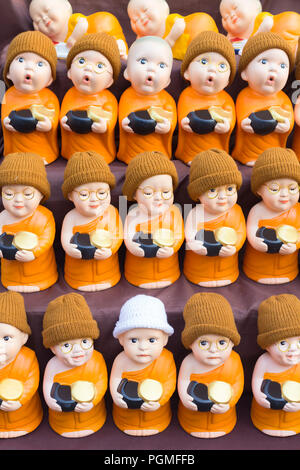 Monk toy puppets on display at a market in Thailand Stock Photo - Alamy