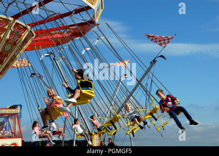 People riding on a carousel Stock Photo - Alamy