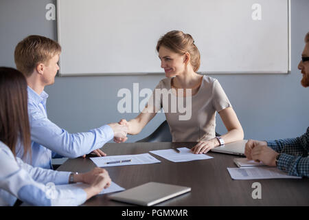 Male with businesswoman are signed successful contract and satisfied of ...