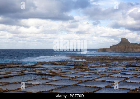 Salt pans and rough sea on Gozo, Malta Stock Photo - Alamy