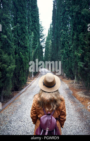 Traveler woman in brown hat and white sweater looking at amazing ...