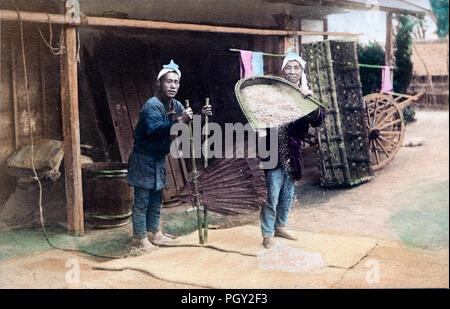 Threshing rice, Japan Stock Photo - Alamy