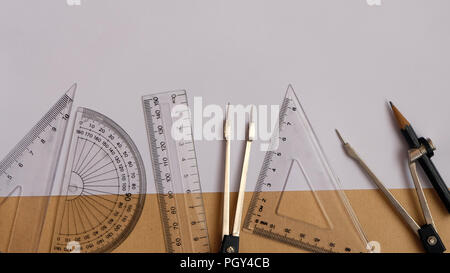 Geometry set with compass, rulers, pencil and protractor on blue ...