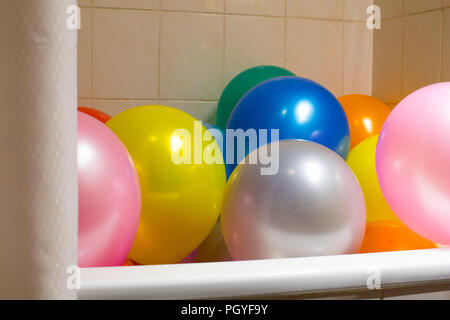 Bath tub full of balloons Stock Photo - Alamy