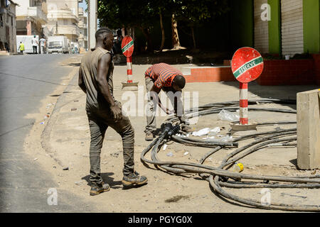 DAKAR, SENEGAL - APR 23, 2017: Unidentified Senegalese boys walk along ...