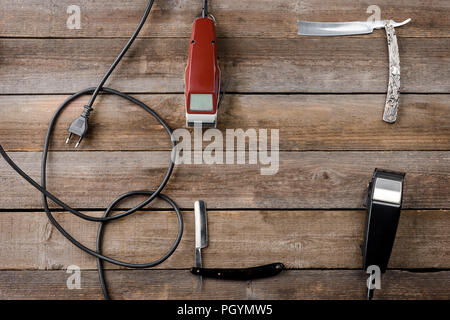 Hair trimmer and straight razor Stock Photo - Alamy
