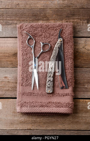 Straight razor and barber scissors Stock Photo - Alamy