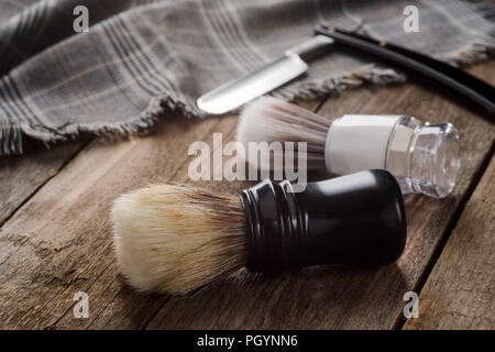 Straight razor on wooden surface Stock Photo - Alamy
