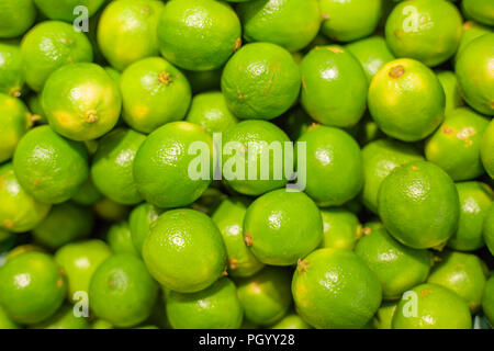 Fresh green lemons in supermarket Stock Photo - Alamy