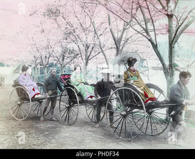 Two women wearing traditional Victorian bathing costumes on the beach ...