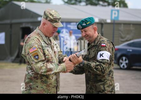 (from right to left) Polish Brig. Gen. Jarosław Gromadziński, Romanian ...