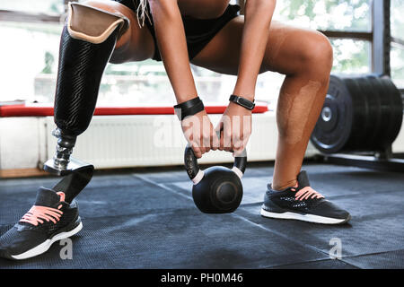Cropped image of amazing sports woman doing fitness exercise while ...