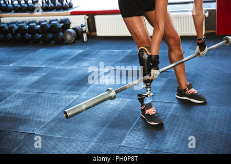 Cropped image of amazing strong disabled sports woman make sport ...