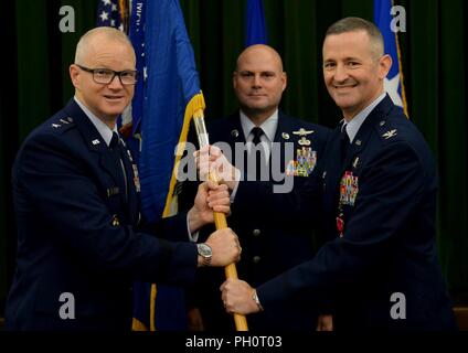 Col. Bradley Pyburn, 67th Cyberspace Wing commander, listens to Maj ...
