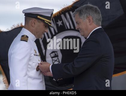 US Navy Commander Dennis Murphy, Commanding Officer of the fast attack ...