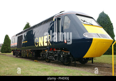 A blue and yellow British Rail express diesel locomotive train Stock ...
