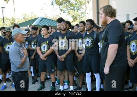 Allen Hoe, father of 1st Lt. Nainoa K. Hoe, receives a National ...